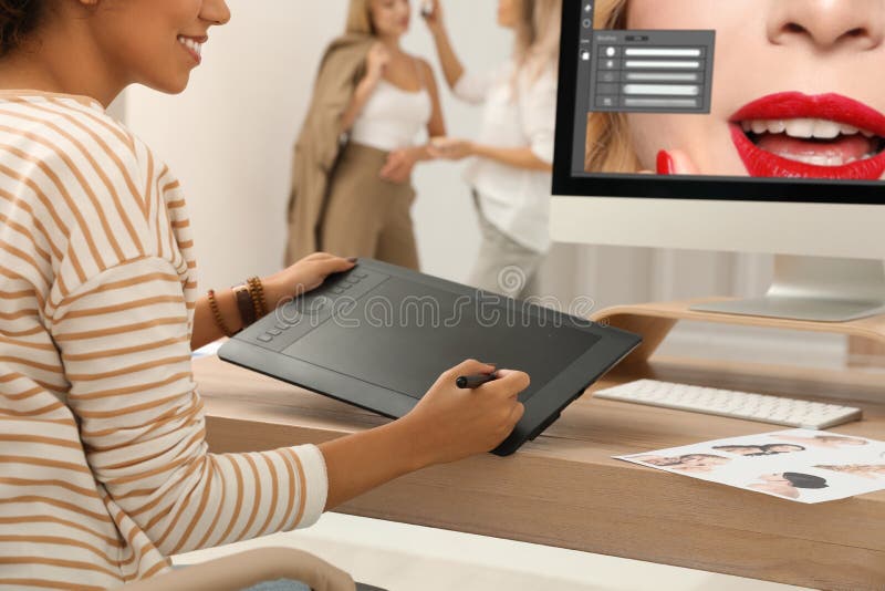 Professional Retoucher Working with Graphic Tablet at Desk in Photo ...