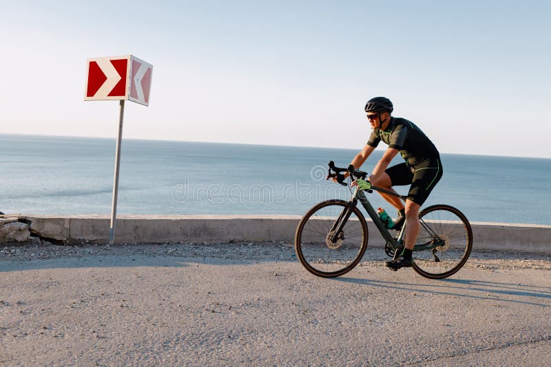 Professional Road Bicycle Racer in Action on Mountain Road Stock Image ...