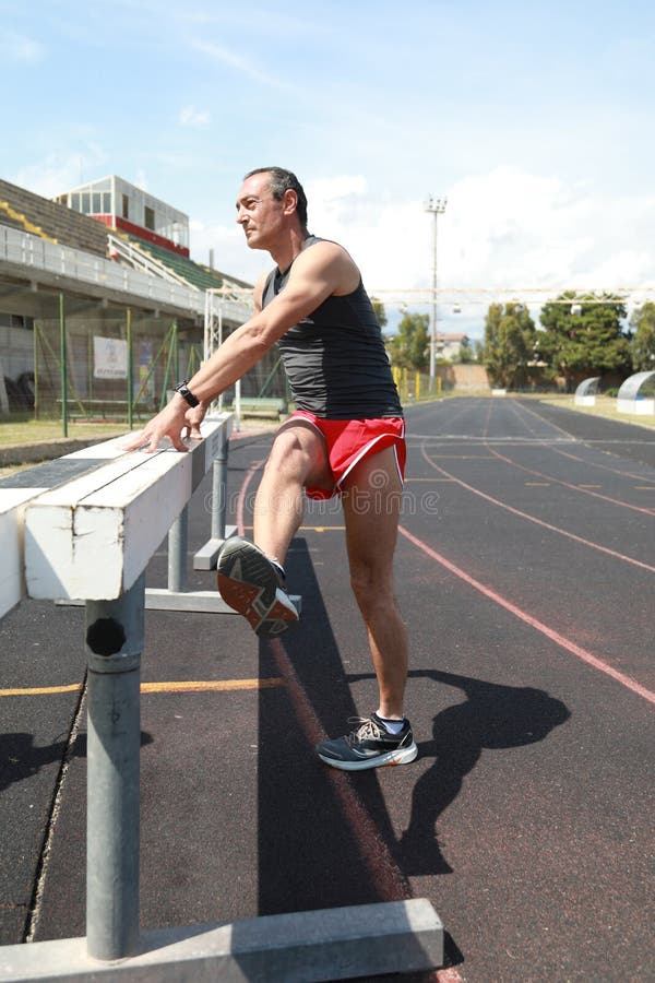 Tired Runner Ready To Stretch Stock Photo - Image of arms, muscle ...