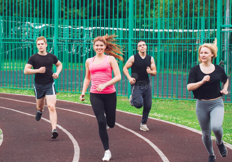 Professional Runners Running on a Race Track Stock Image - Image of ...