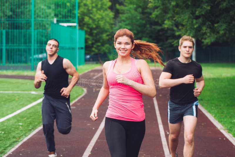 Professional Runners Running on a Race Track Stock Photo - Image of ...