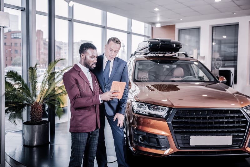 Professional Sales Manager Showing Technical Information about Car ...