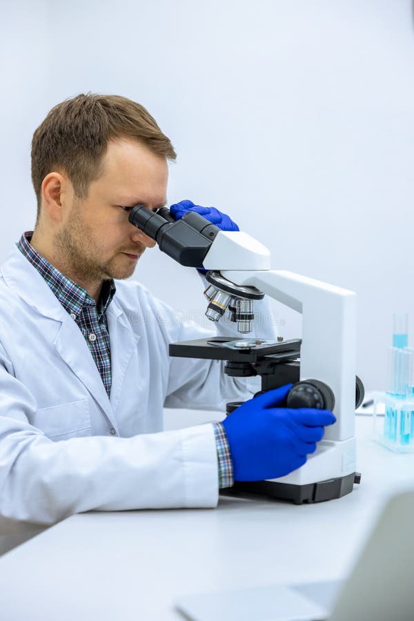 Scientist Man Doing Chemical Experiment, Making Analyzing, Looking ...