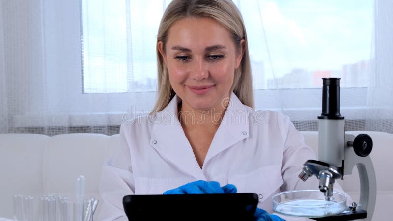 Professional Scientist Research Chemist with a Tablet Computer and a ...