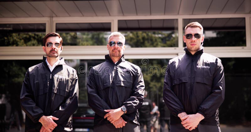 Professional Security Guard Ensuring Event Safety with His Team of ...