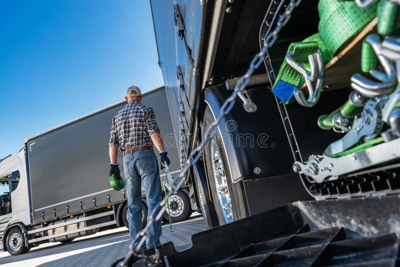 Professional Semi Truck Driver Working on Back of Truck Stock Image ...