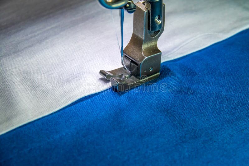 Professional Sewing Machine with White and Blue Fabric Stock Photo ...