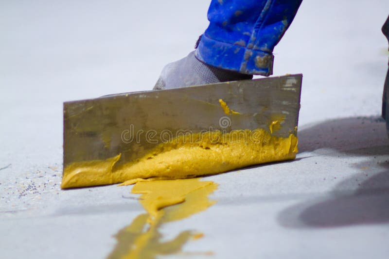 Professional is Skillfully Filling the Expansion Joints with Epoxy ...