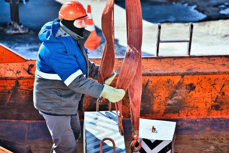 Professional Slinger in Construction Helmet at Factory Unloads Cargo ...