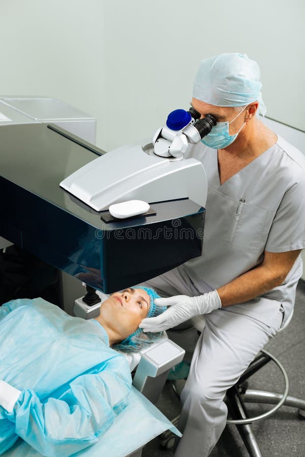 Professional Smart Doctor Keeping the Patients Head Fixed Stock Photo ...