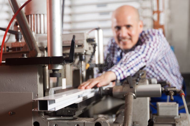 Worker Toiling on a Machine in PVC Shop Stock Photo - Image of people ...