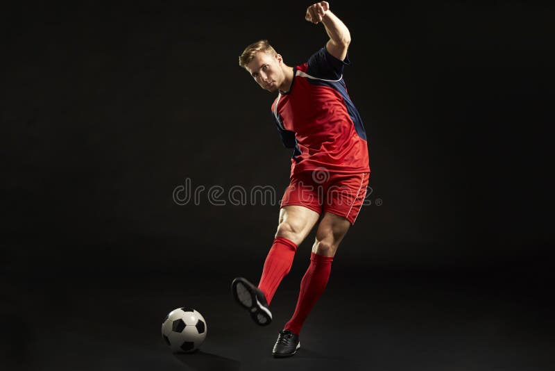 Professional Soccer Player Shooting at Goal in Studio Stock Image ...