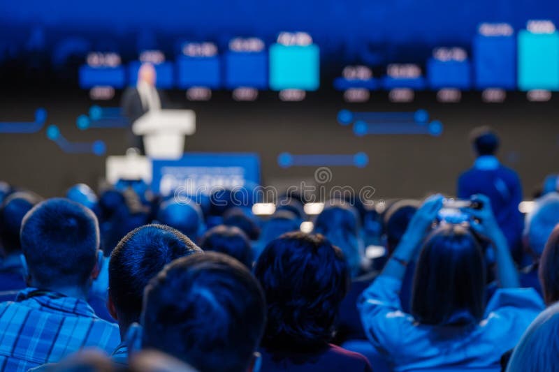 Professional Speaker at Conference Podium Addressing an Audience Stock ...