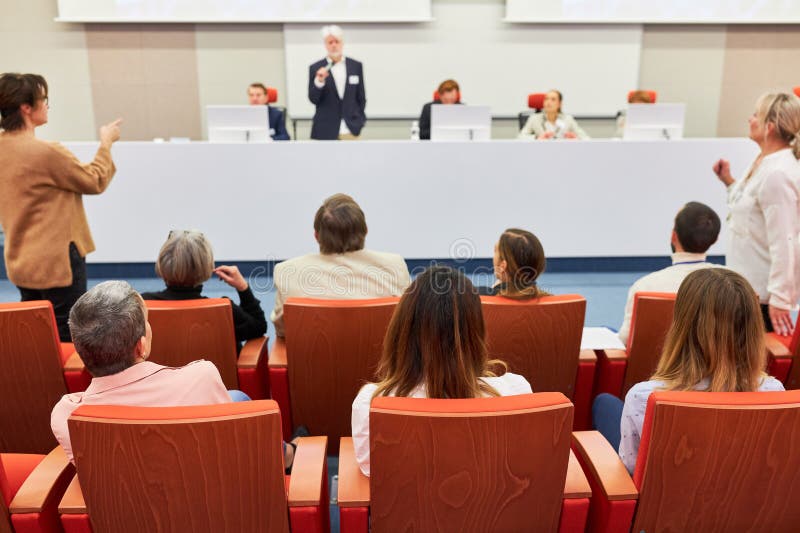 Professional Speaker Engaging with Audience during Interactive Seminar ...
