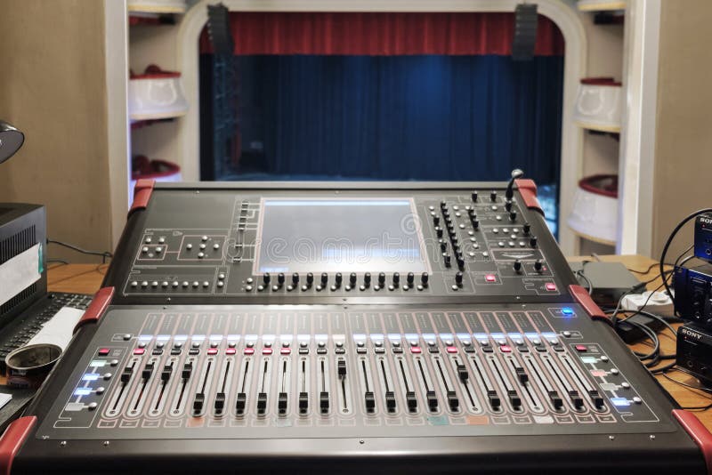 Professional Stage Lighting Control Console with Blurred Background of ...