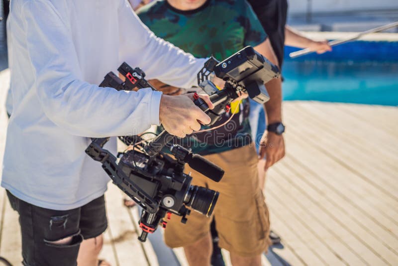 Professional Steadicam Operator Uses a 3-axis Camera Stabilizer System ...