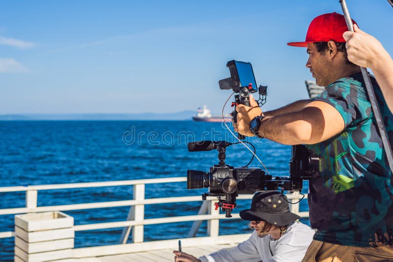 Professional Steadicam Operator Uses a 3-axis Camera Stabilizer System ...