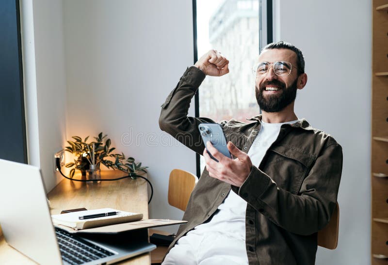 Professional, Stylish Man Working Remotely in a Modern Cafe Stock Image ...