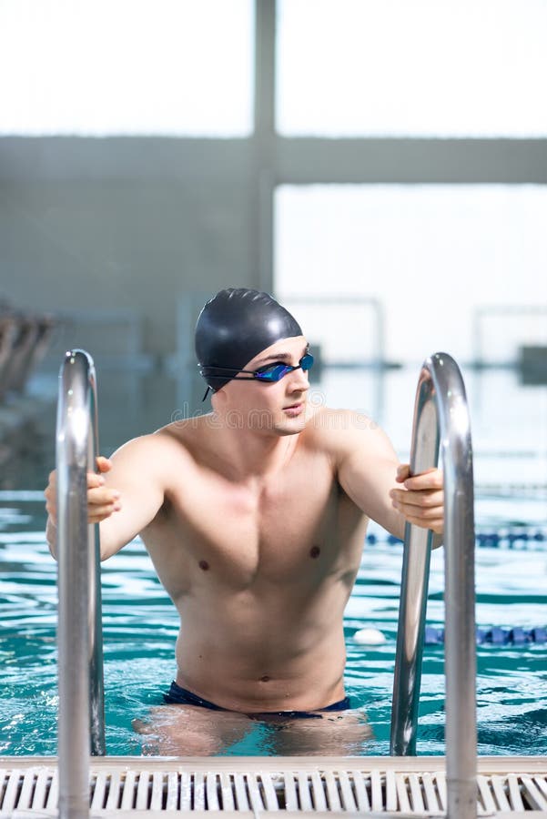 Muscular Swimmer on the Ladder Stock Photo - Image of exercise, angle ...