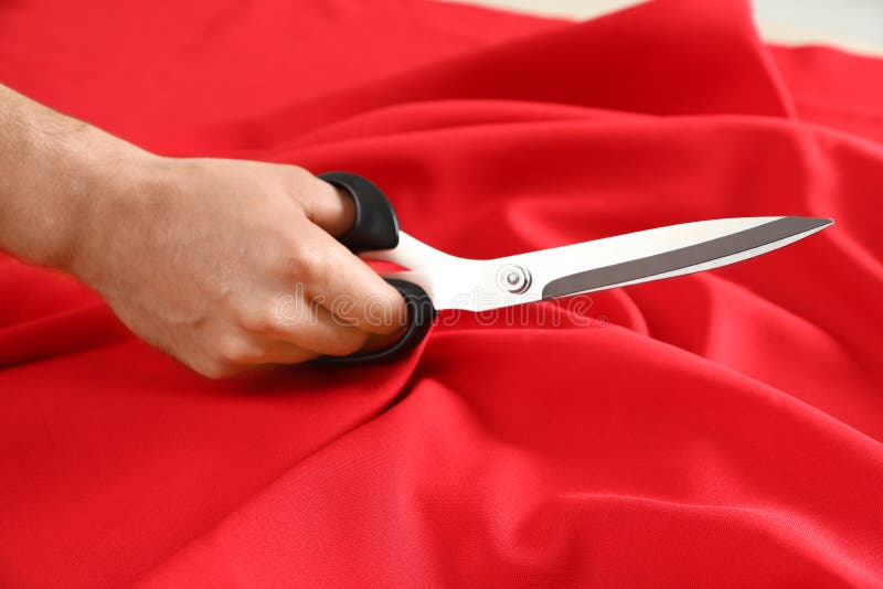 Professional Tailor Cutting Red Fabric with Scissors in Workshop Stock ...