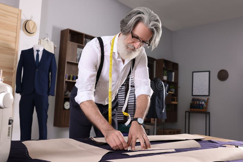 Professional Tailor Marking Sewing Pattern on Fabric with Chalk at ...