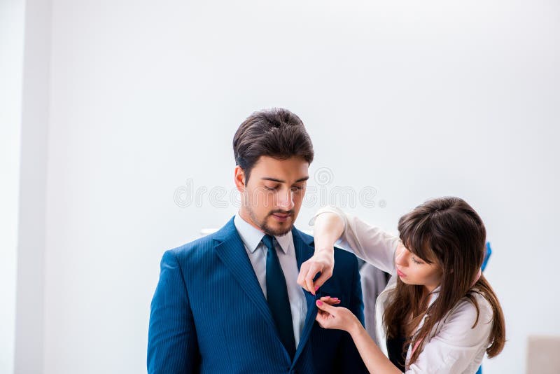 The Professional Tailor Taking Measurements for Formal Suit Stock Photo ...