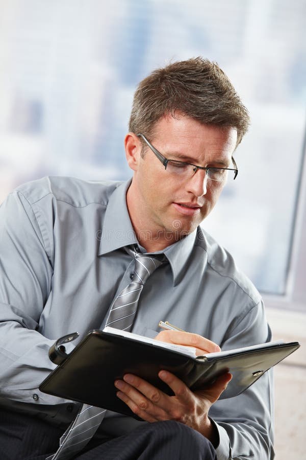 Professional Taking Notes into Organiser Stock Image - Image of ...