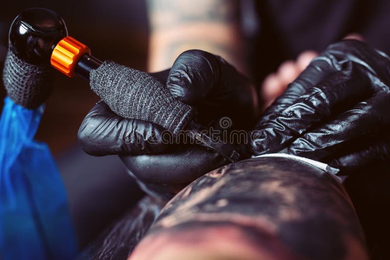 Professional Tattoo Artist Makes a Tattoo on a Man`s Hand Stock Image ...