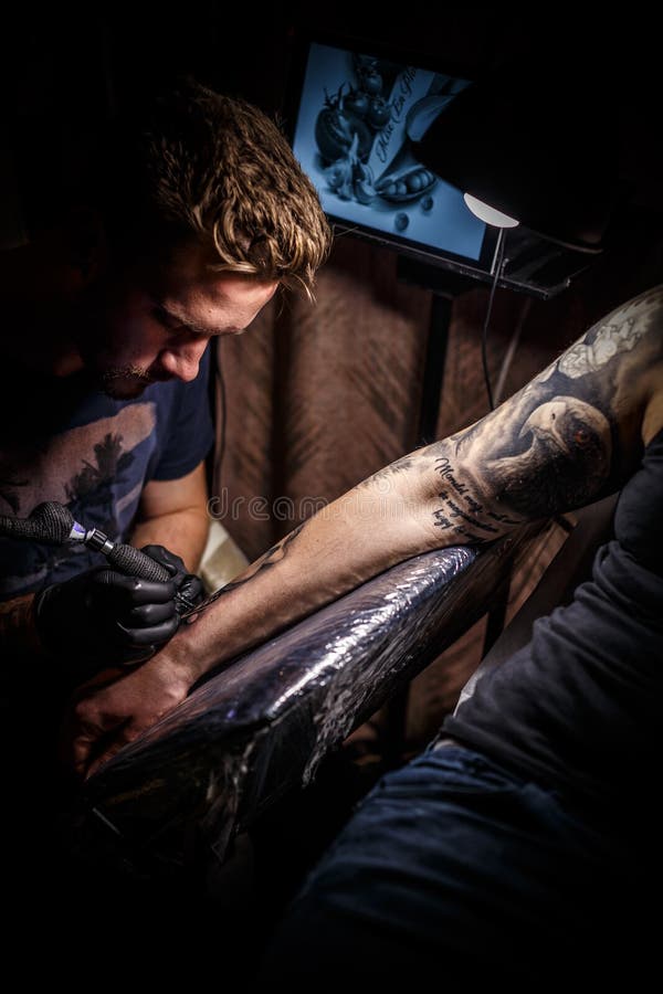 Professional tattooer stock photo. Image of black, process - 103187372