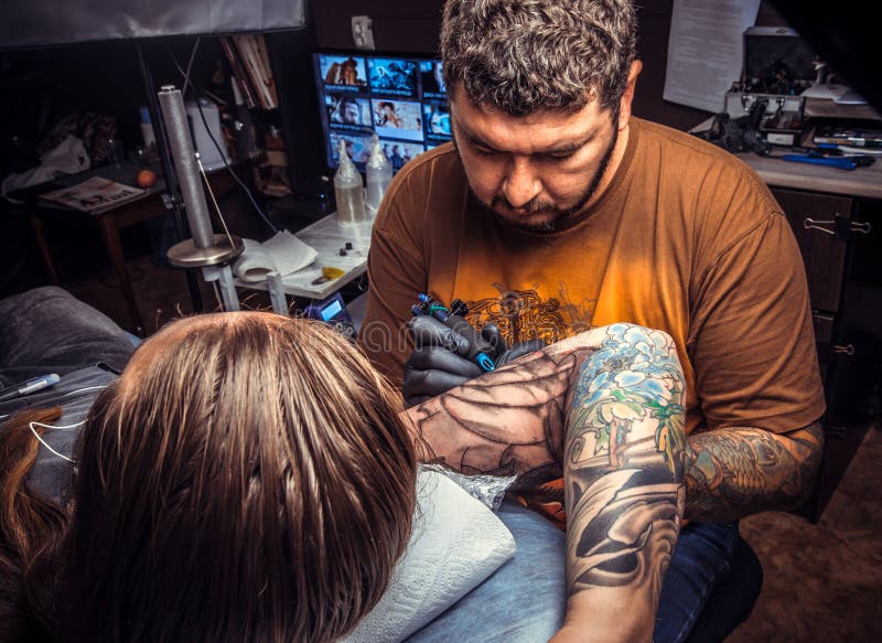Professional Tattooer at Work in Tattoo Studio Stock Photo - Image of ...