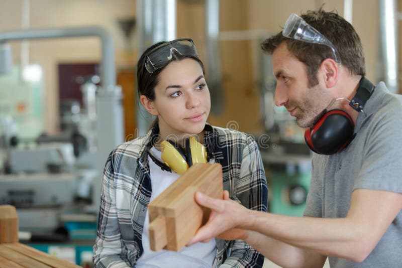 Professional Teacher Showing Carpentry Machinery To Student Stock Image ...