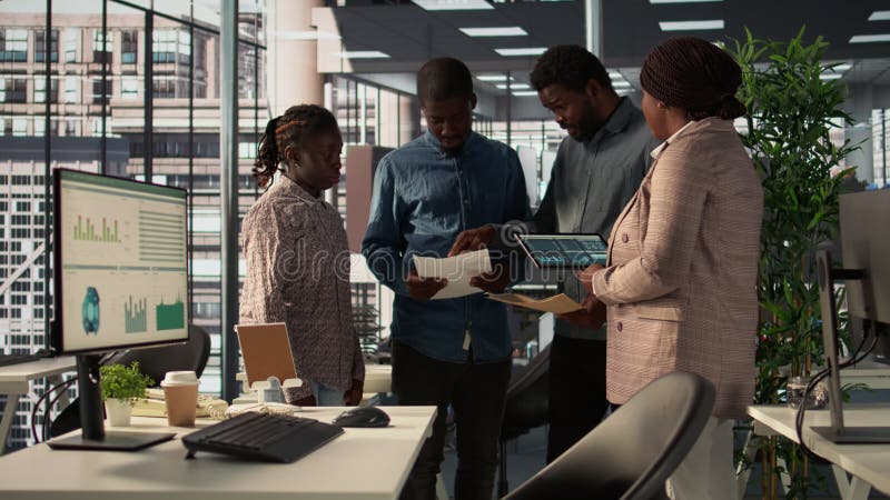 Professional Team Analyzing Archived Data on a Modern Device Stock ...