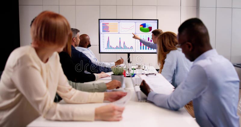Professional Team in a Conference Room with TV Screen Stock Image ...