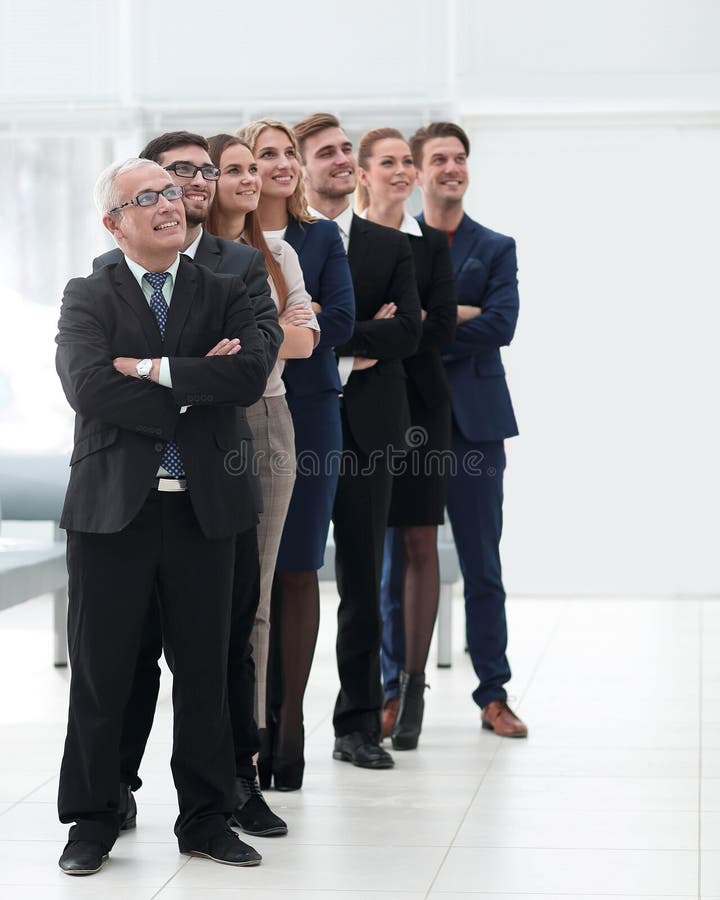 Professional Team Confidently Look Forward, Standing in the Middle of ...