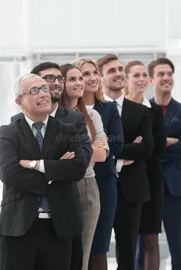 Professional Team Confidently Look Forward, Standing in the Middle of ...