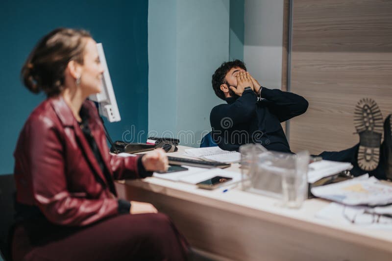 Two Colleagues Dealing with Stress during an Office Meeting Stock Image ...