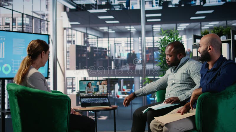 Professional Team Using Video Call Technology To Support Company ...