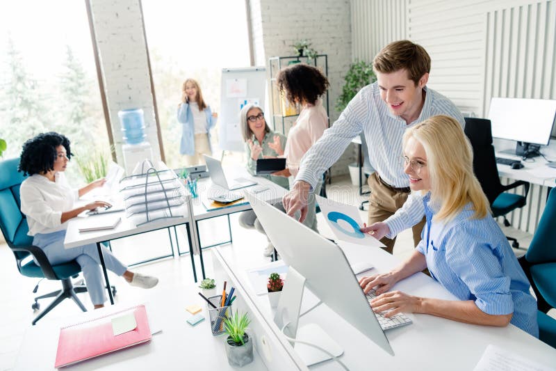 Professional Team Working Together in a Modern, Collaborative Office ...