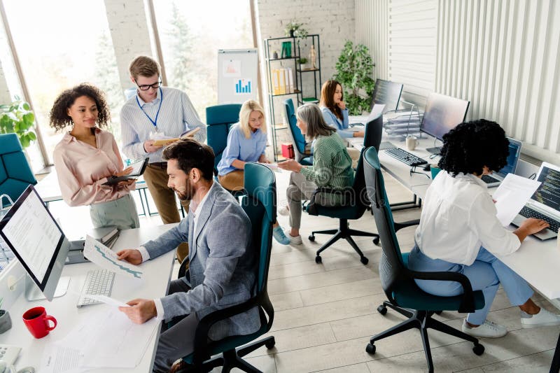 Professional Teamwork in a Vibrant Office Environment with Diverse ...