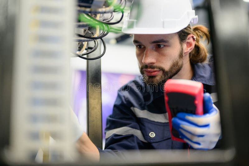 Professional Technician Checking and Repairing Part of Automatic ...