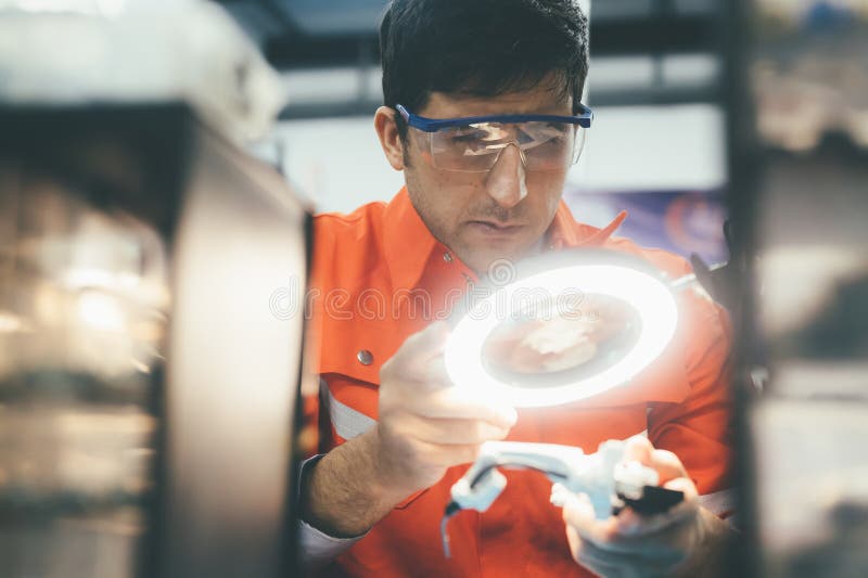 Professional Technician Checking and Repairing Parts of Robotic Machine ...