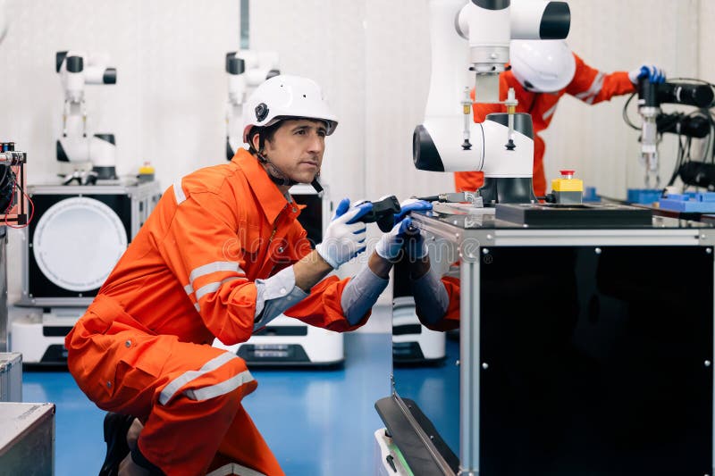 Professional Technician Holding Robot Controller Checking Automatic ...