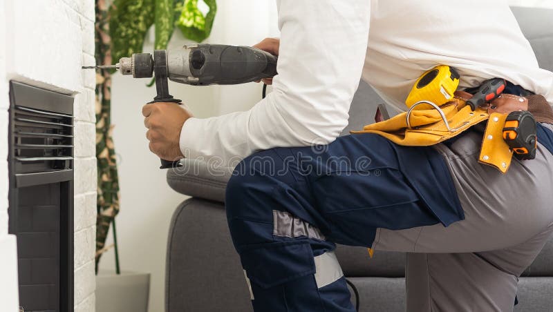 Professional Technician Installing Electric Fireplace in Room Stock ...