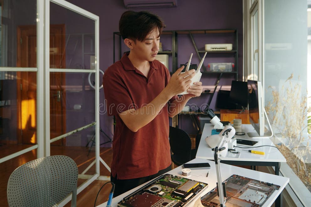 Technician Repairing Router in Workshop Stock Photo - Image of ...