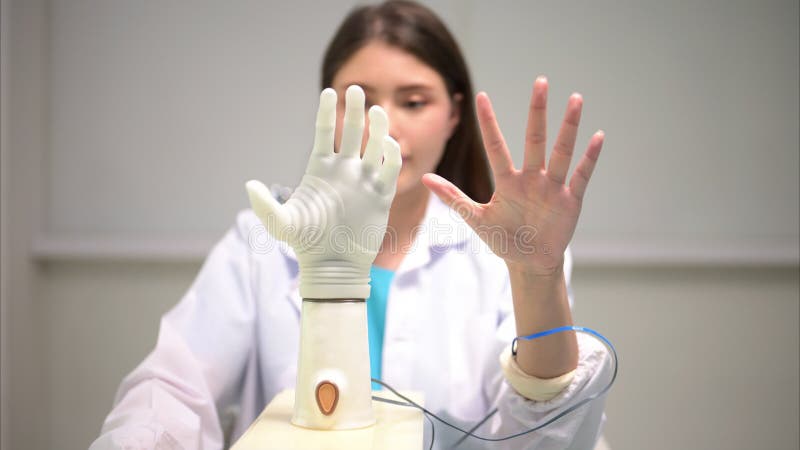 Technician Testing Robotic Bionic Arm at Prosthetic Manufacturing Stock ...