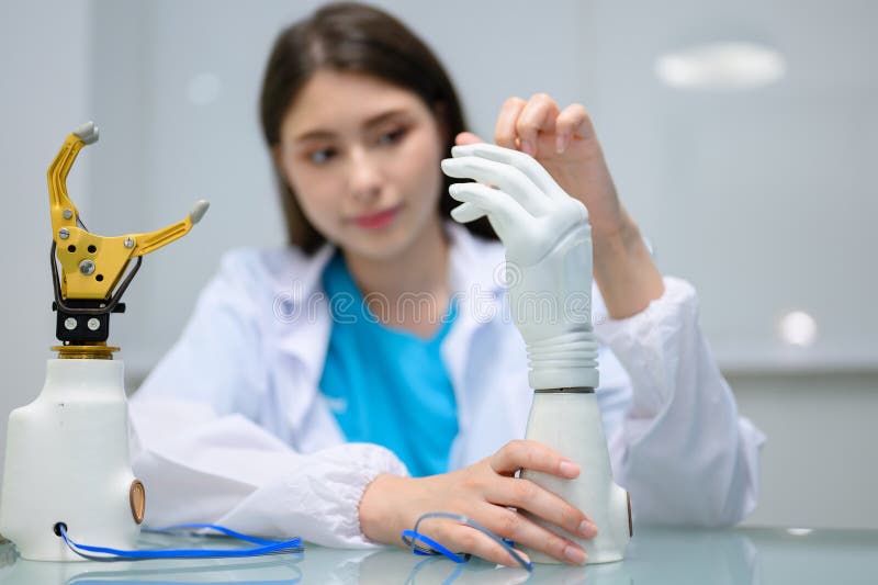 Technician Testing Robotic Bionic Arm at Prosthetic Manufacturing Stock ...
