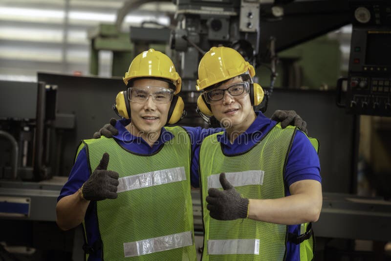 Professional Technicians and Engineers Wearing Protective Clothing ...