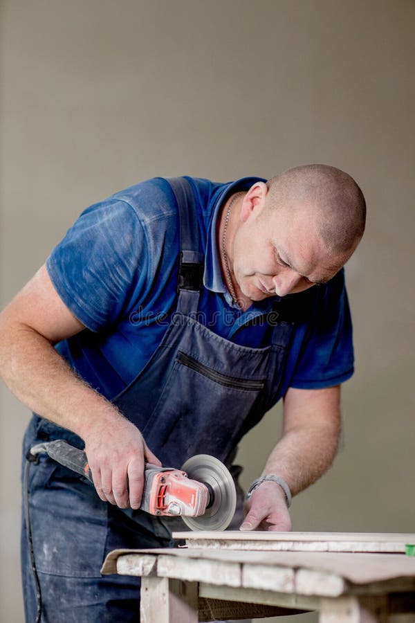 Professional Tiler Cutting Ceramic Tile for the Floor or Wall. Flooring ...