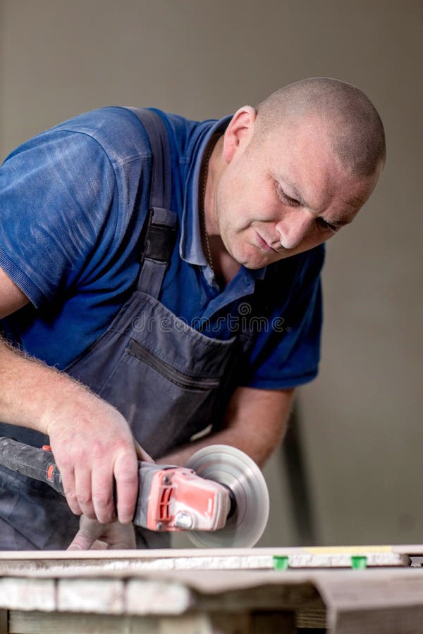 Professional Tiler Cutting Ceramic Tile for the Floor or Wall. Flooring ...