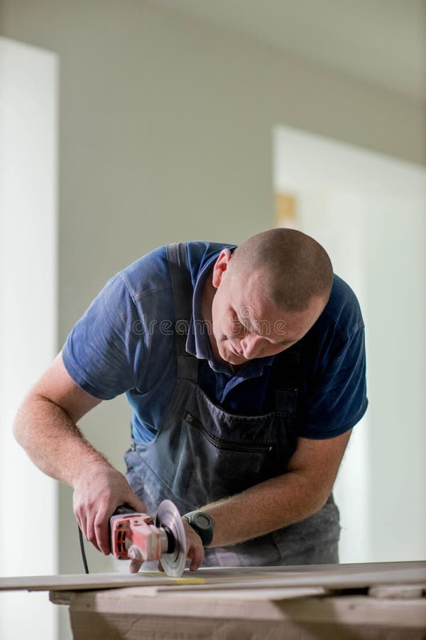 Professional Tiler Cutting Ceramic Tile for the Floor or Wall. Flooring ...